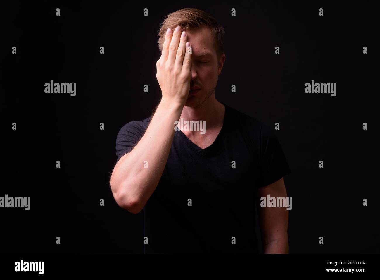 Portrait of stressed young man looking frustrated Stock Photo - Alamy