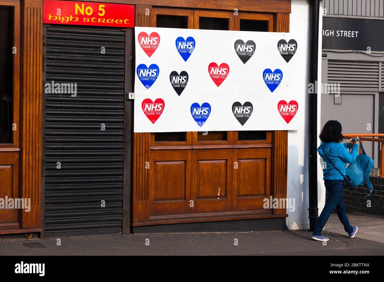 Shuttered shop front with NHS sign over the window, Beckenham, London ...