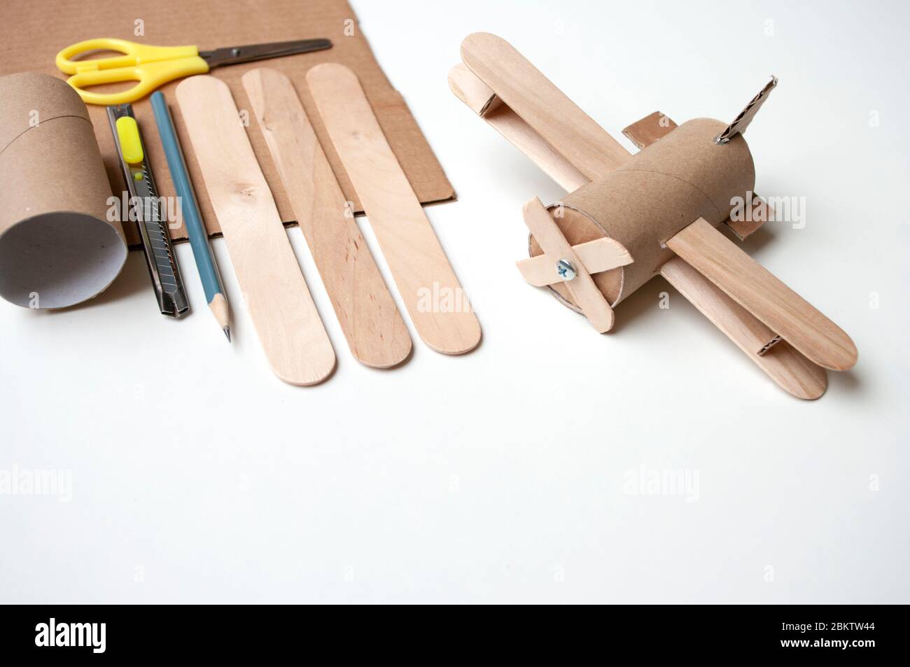 How to make airplane from toilet paper roll and popsicle sticks. Zero ...
