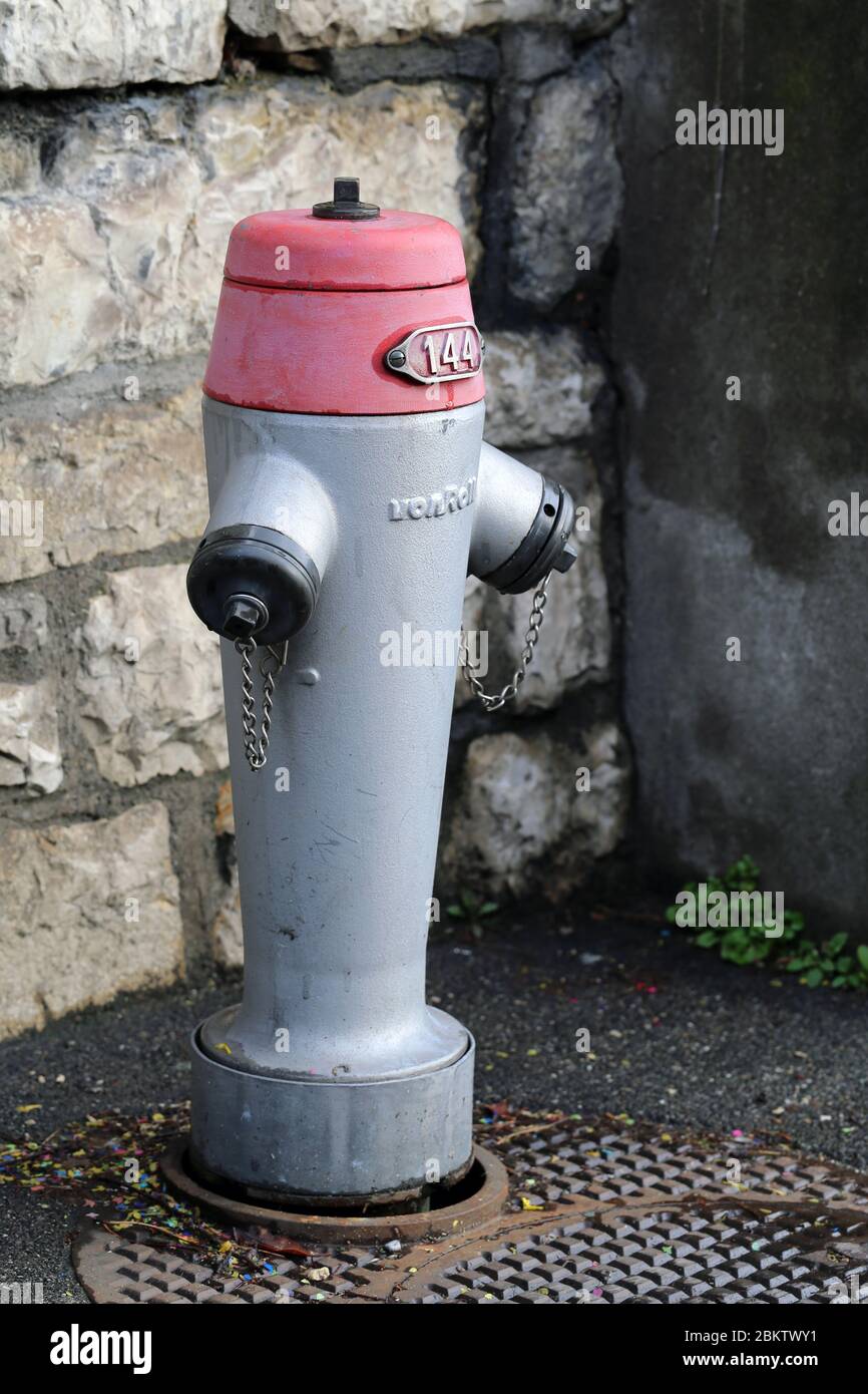 Red and silver fire hydrant in Baden, Switzerland, March 2020. Portrait ...