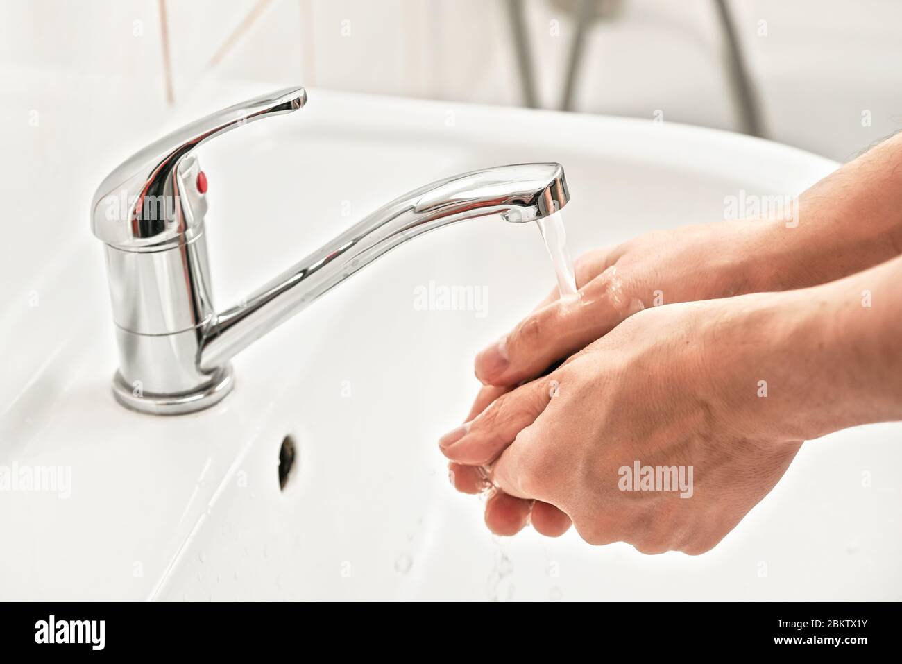 Man washing hands under water tap faucet. Personal hygiene concept, can ...