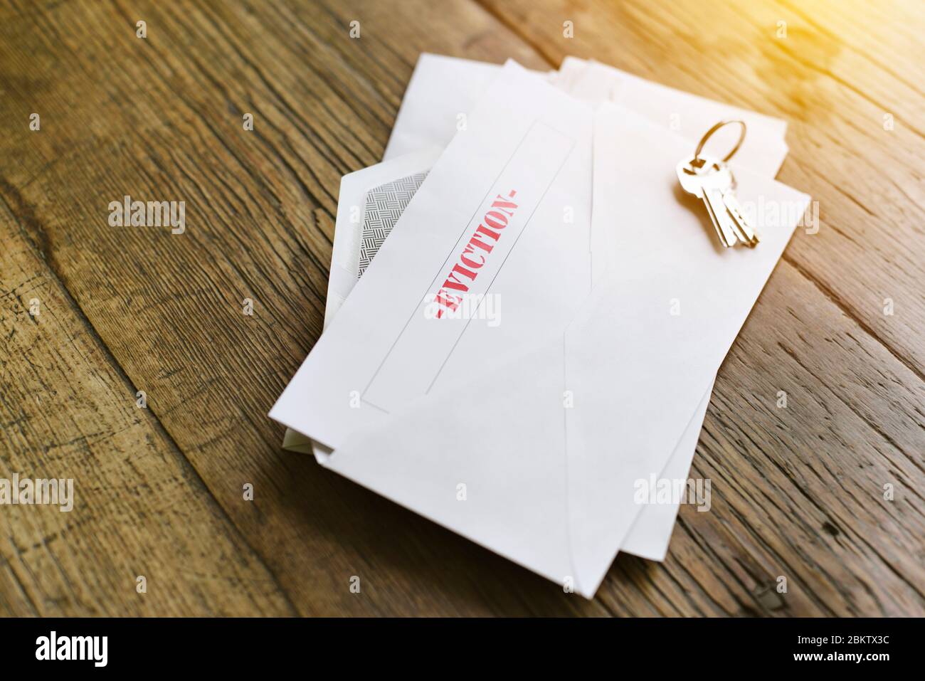 Open envelope with an eviction notice - Keys - Late rent - Overdue ...