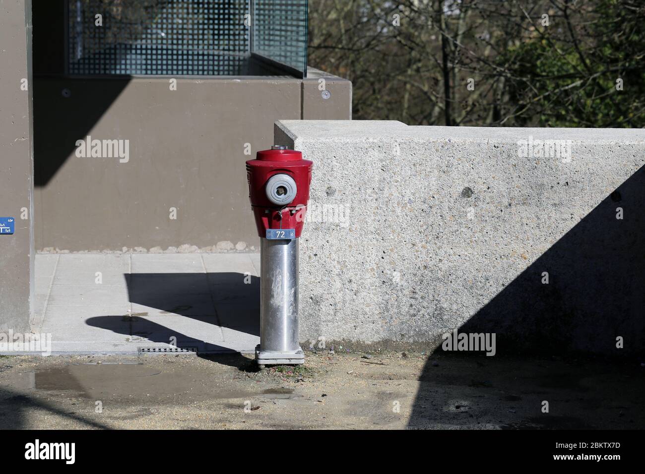 Red and silver fire hydrant in Baden, Switzerland, March 2020. Portrait ...