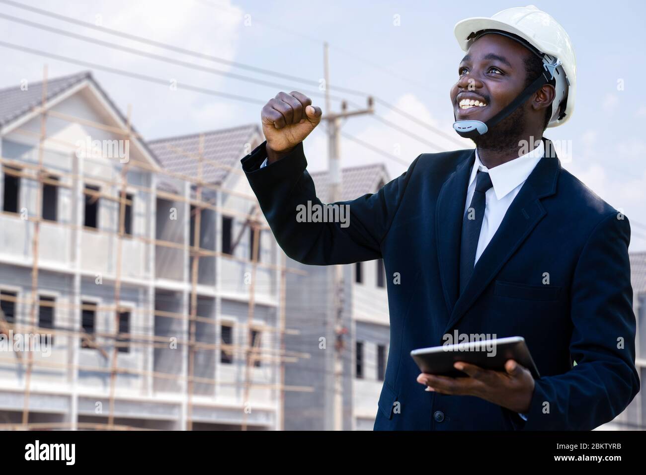 Portrait of success african industrial engineer manager standing with ...