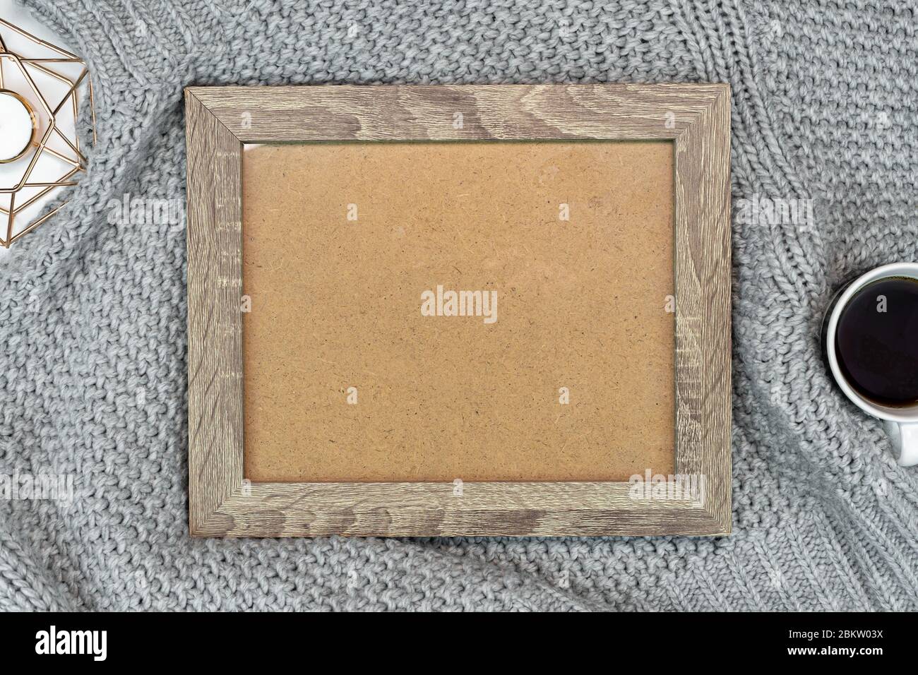 Flat lay photo frame on cosy warm plaid sweater. and coffee. Winter ...