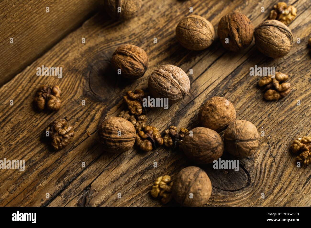 Walnut scattered on the wooden vintage table. Walnuts is a healthy ...