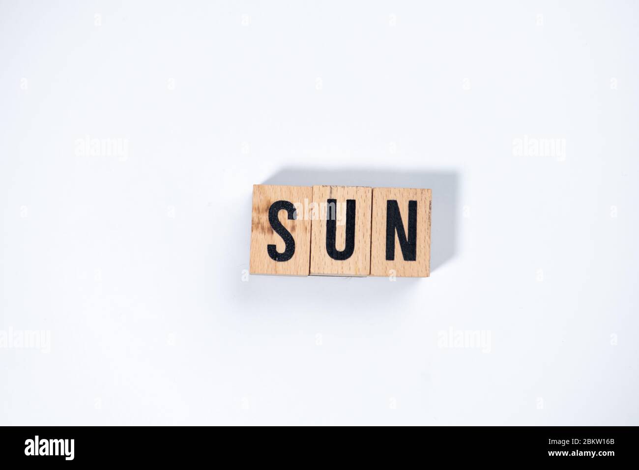 " SUN " text made of wooden cube on White background Stock Photo - Alamy