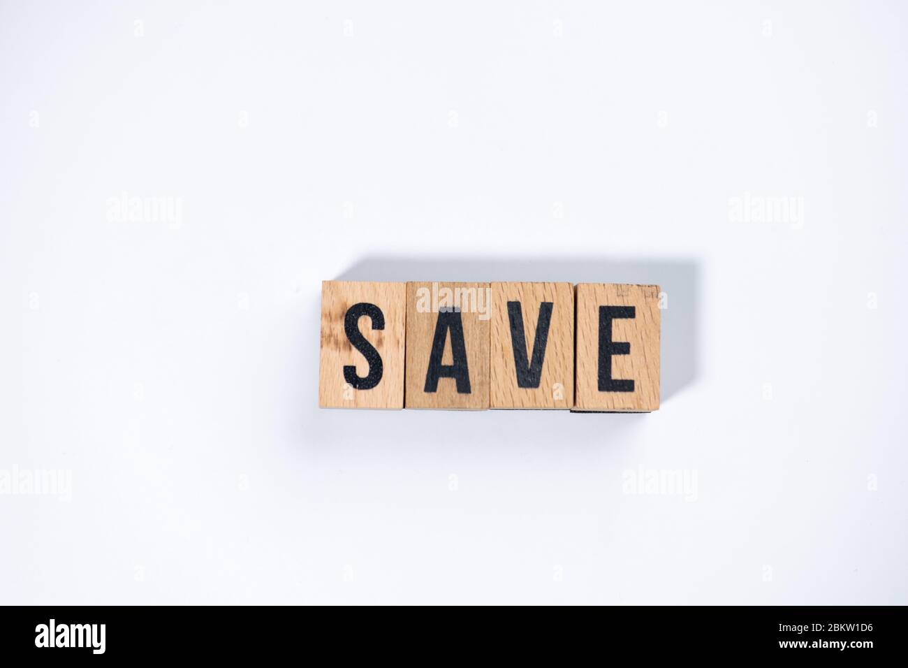 " SAVE " text made of wooden cube on White background Stock Photo - Alamy