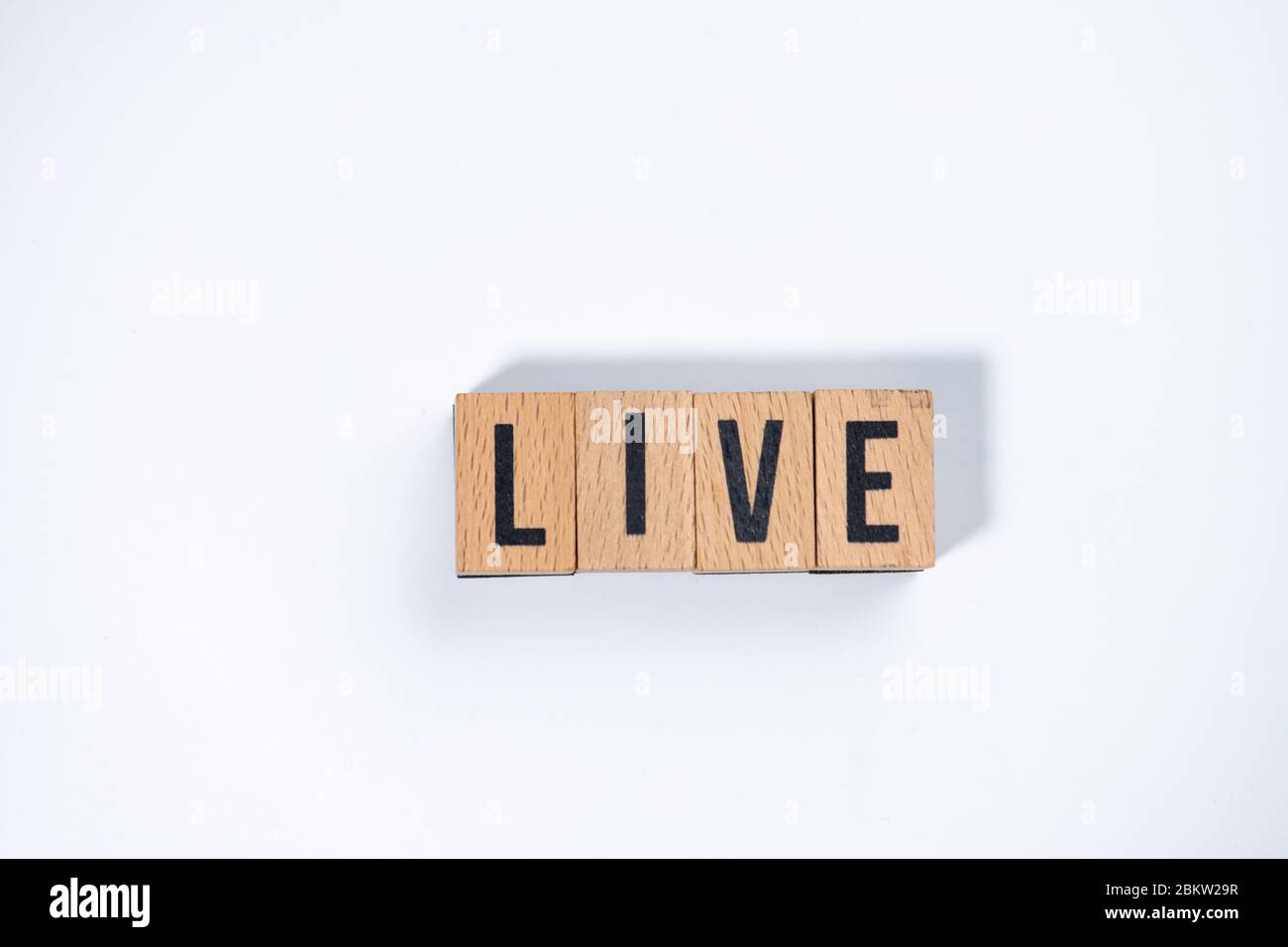 " LIVE " text made of wooden cube on White background Stock Photo - Alamy