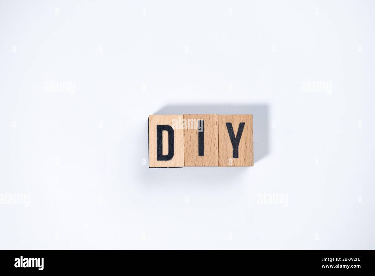 " DIY " text made of wooden cube on White background Stock Photo - Alamy