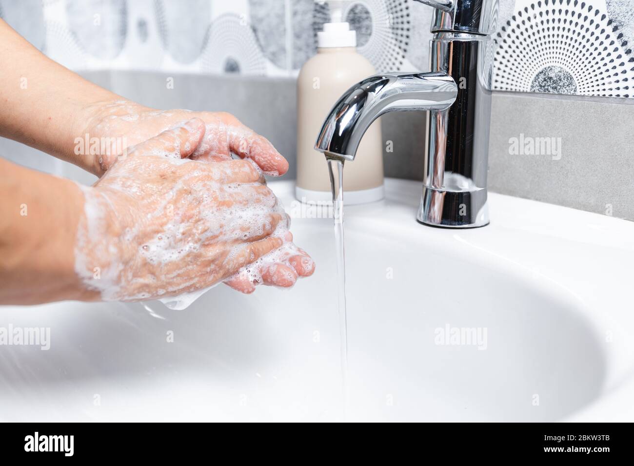 Person washing hi-res stock photography and images - Alamy