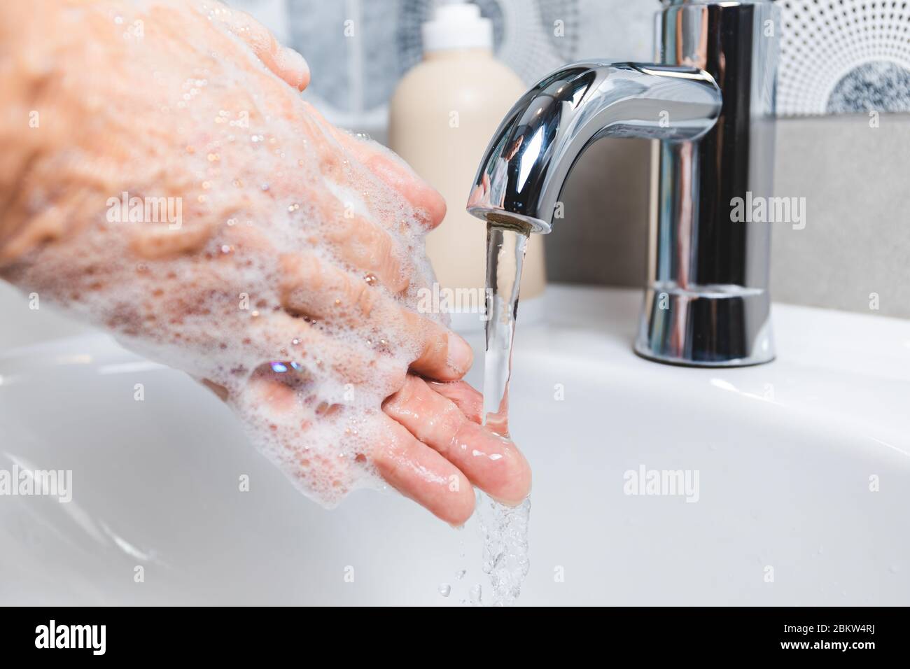 Person washing hands hi-res stock photography and images - Alamy