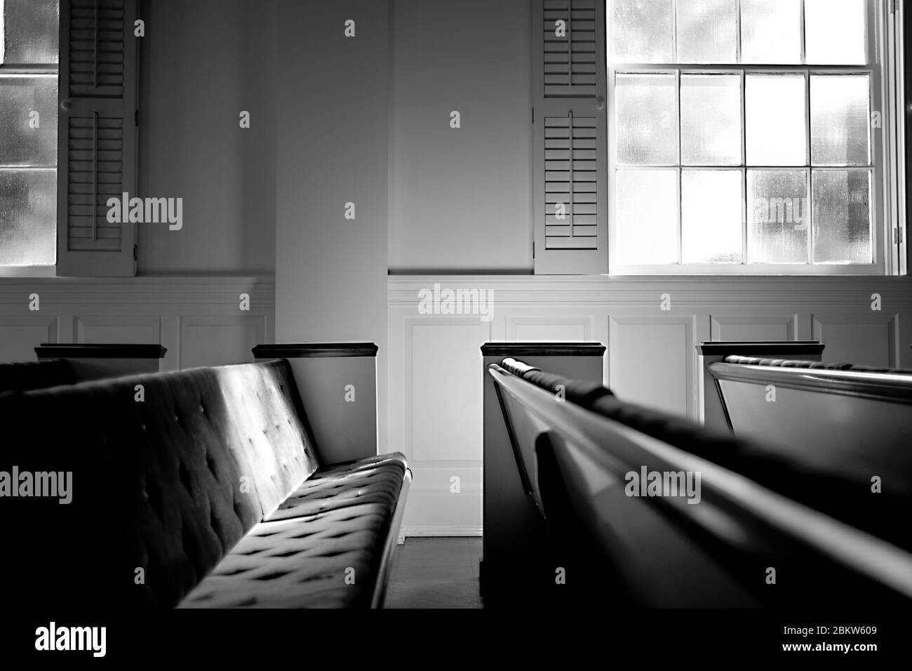 Empty pew bench seating in small church Stock Photo - Alamy