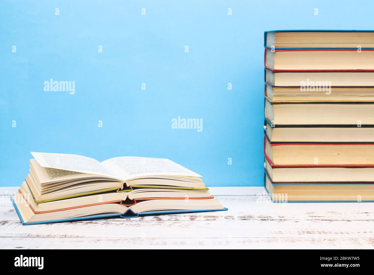 Pile of different books on the table Stock Photo - Alamy