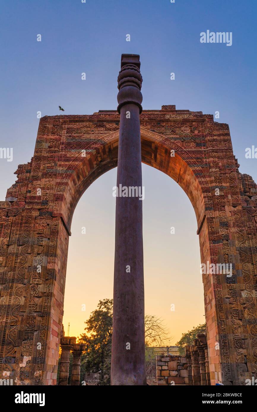 Iron pillar of Delhi, Qutb Minar complex at night, Delhi, India Stock ...