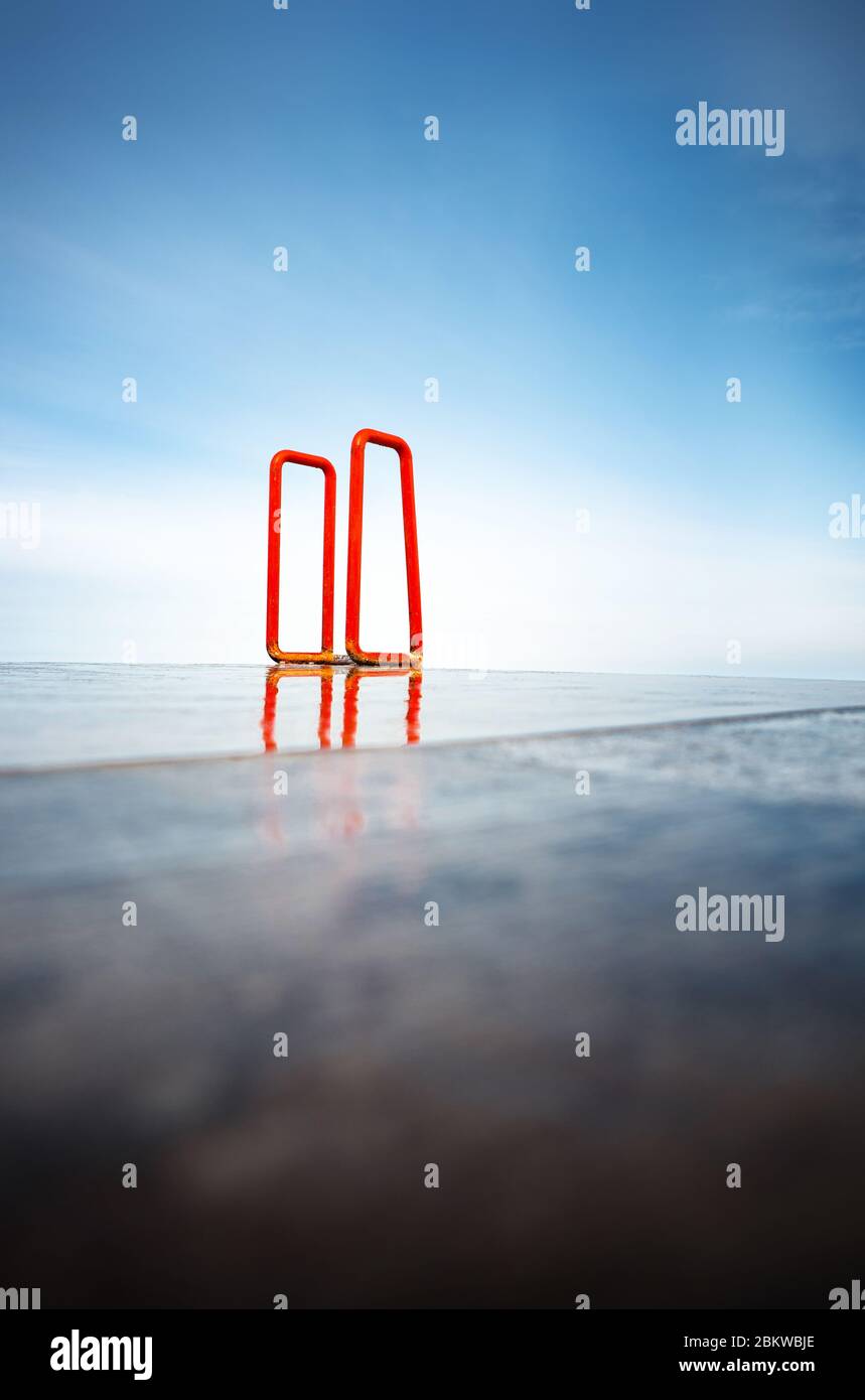 Minimal Orange Step Ladder Reflection Behind a Blue Sky of Lake ...