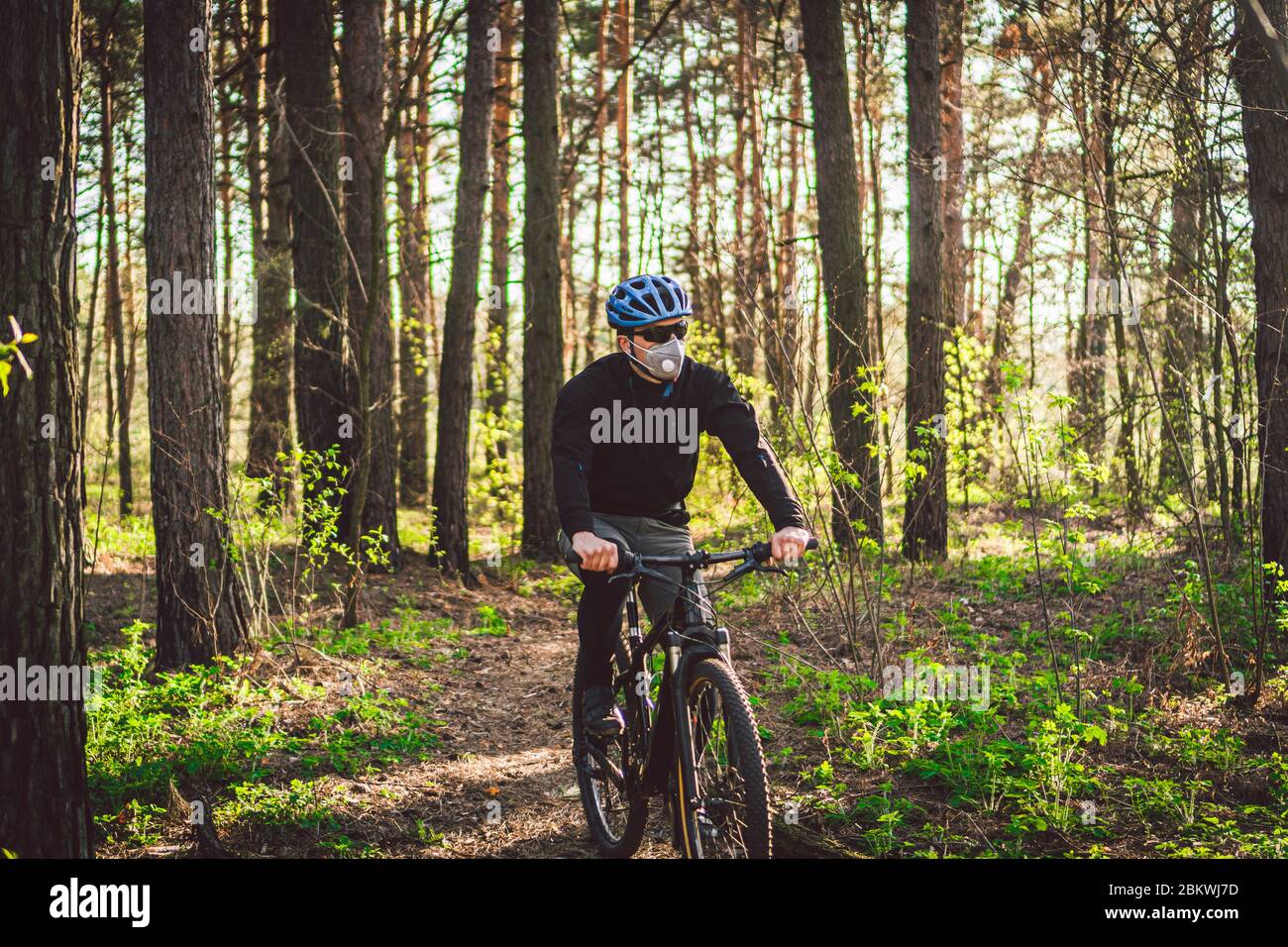 Sport. Mountain Bike cyclist riding single track. Man on bike wearing ...
