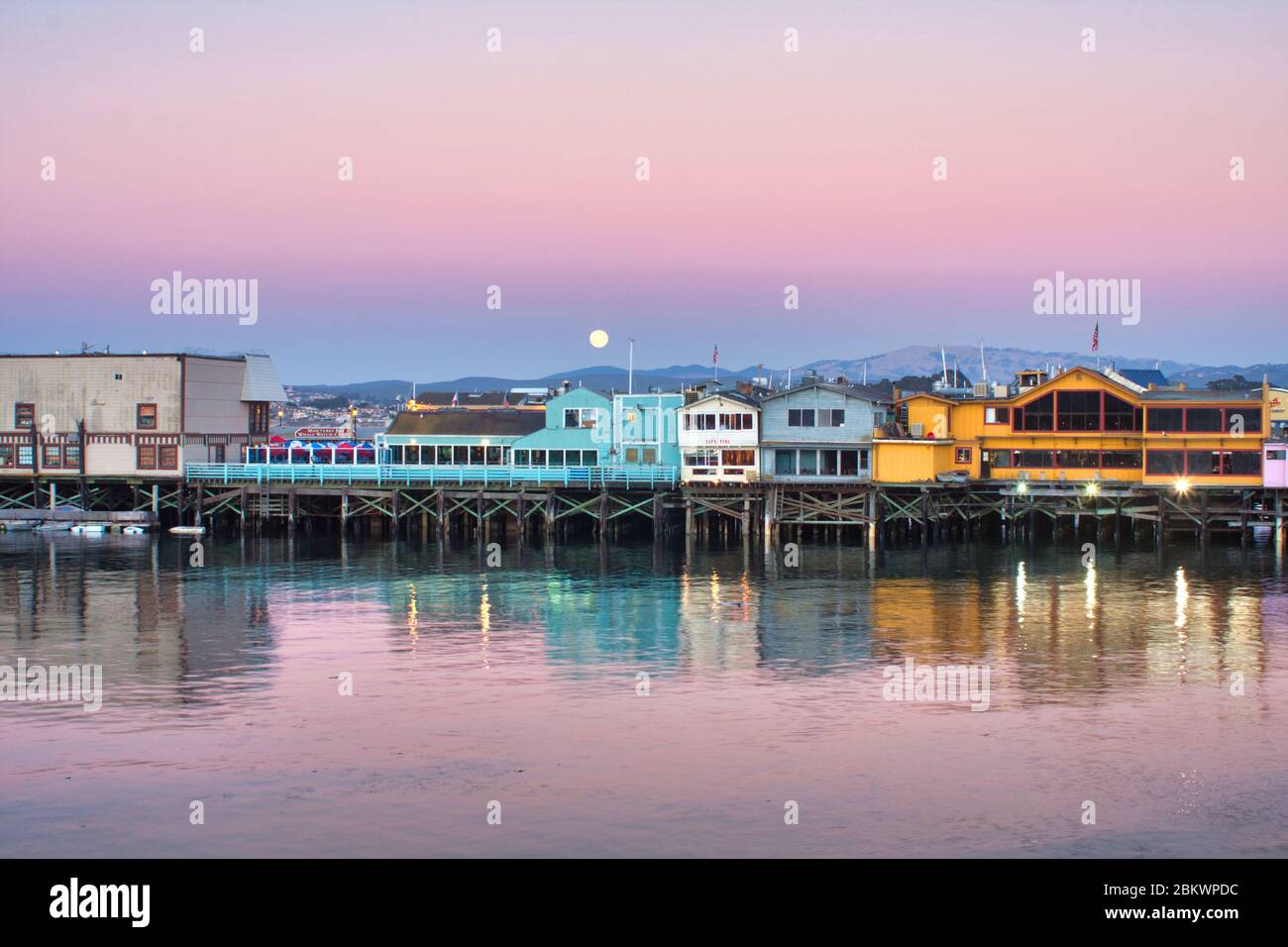Early morning moonrise over fisherman's wharf in Monterey, CA Stock ...
