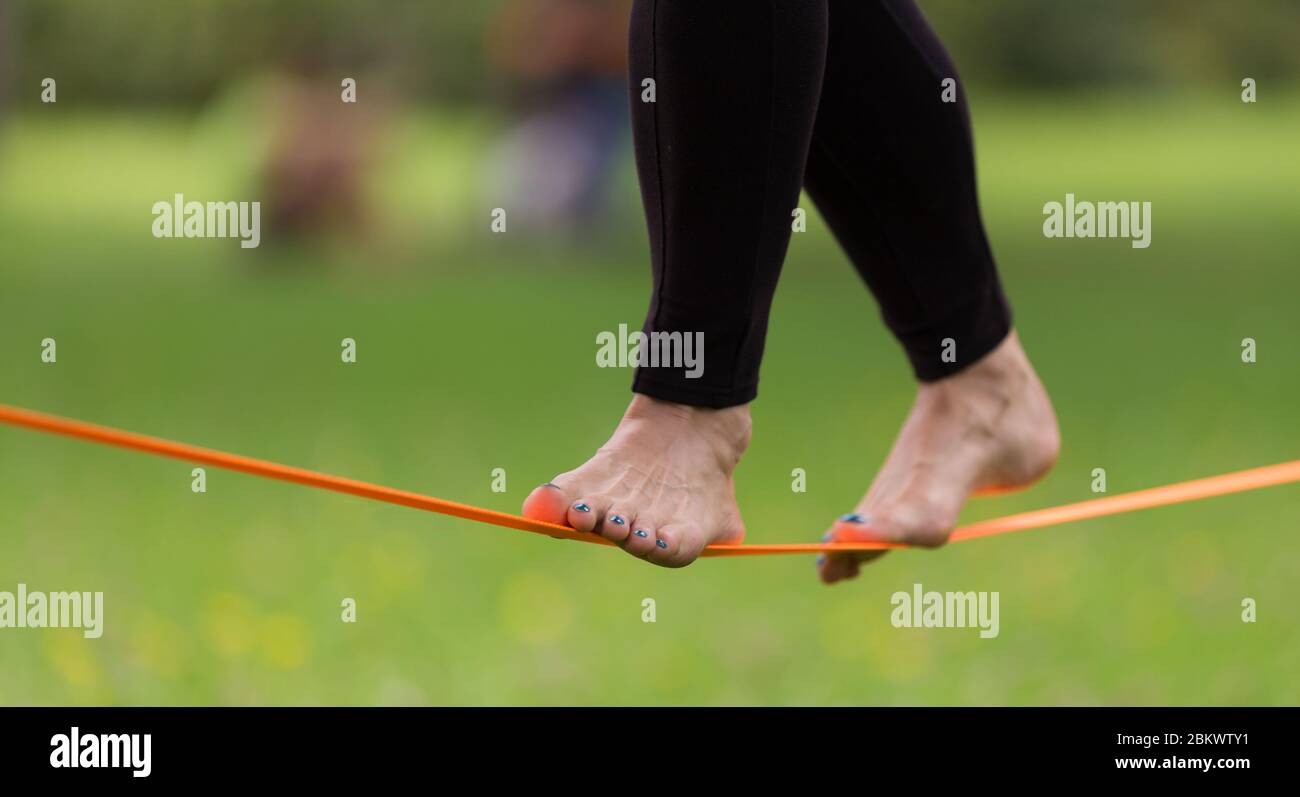 Slack line in the city park Stock Photo - Alamy