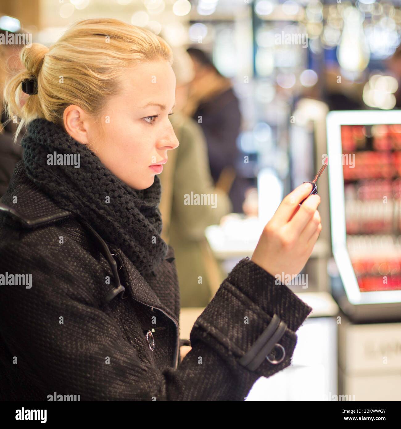 Beautiful woman shopping in beauty store Stock Photo - Alamy