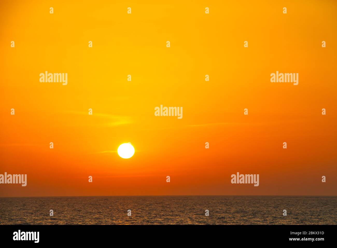 Sun Setting Over the Ocean Stock Photo - Alamy