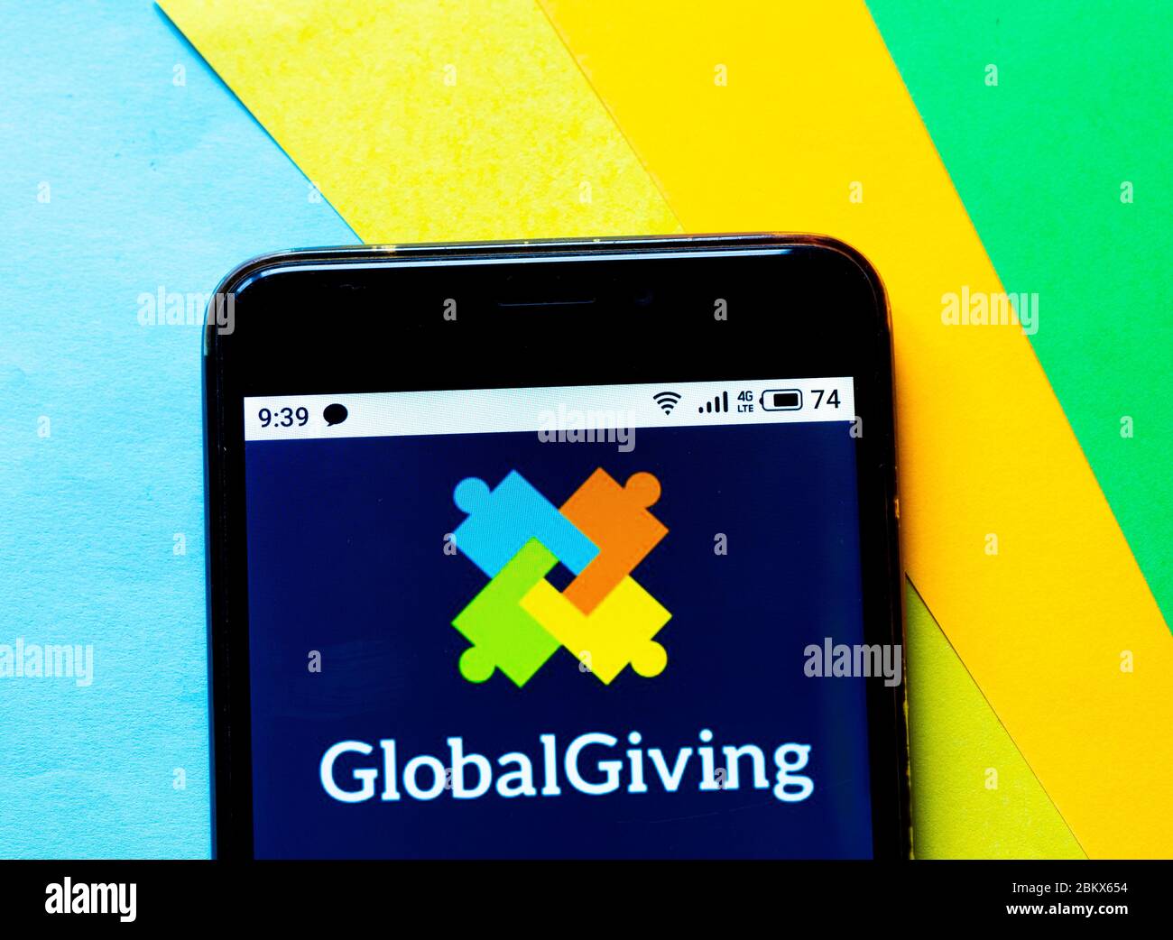 In this photo illustration a GlobalGiving logo seen displayed on a ...