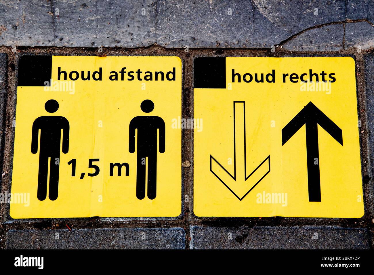 A sign of 1,5 meter on the floor at a train station showing the ...