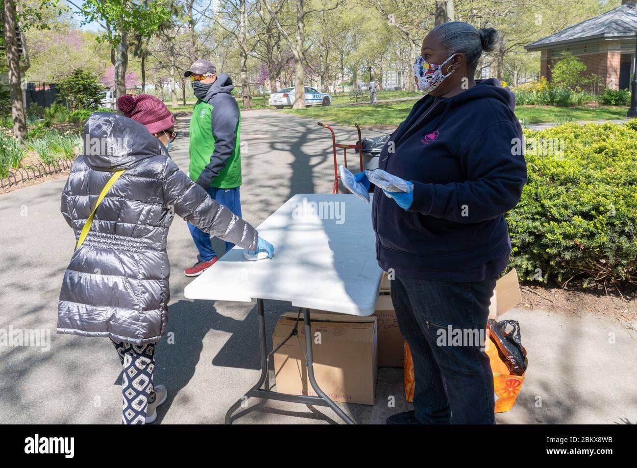 NEW YORK, NY - MAY 5, 2020: A woman receives free face masks from NYC ...