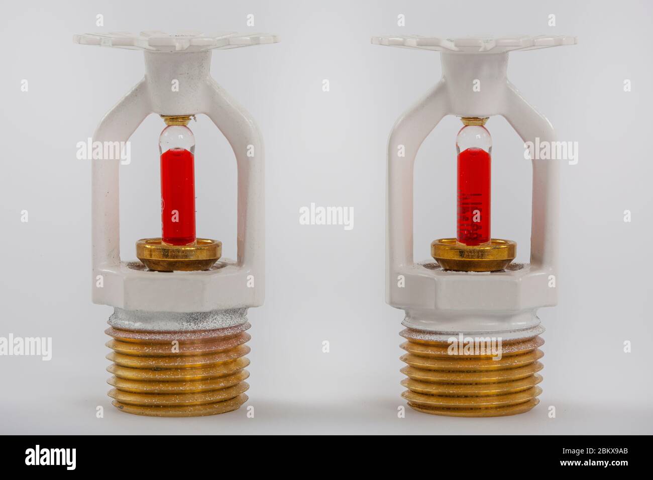 Close up image of fire sprinkler with fire in background. Fire ...