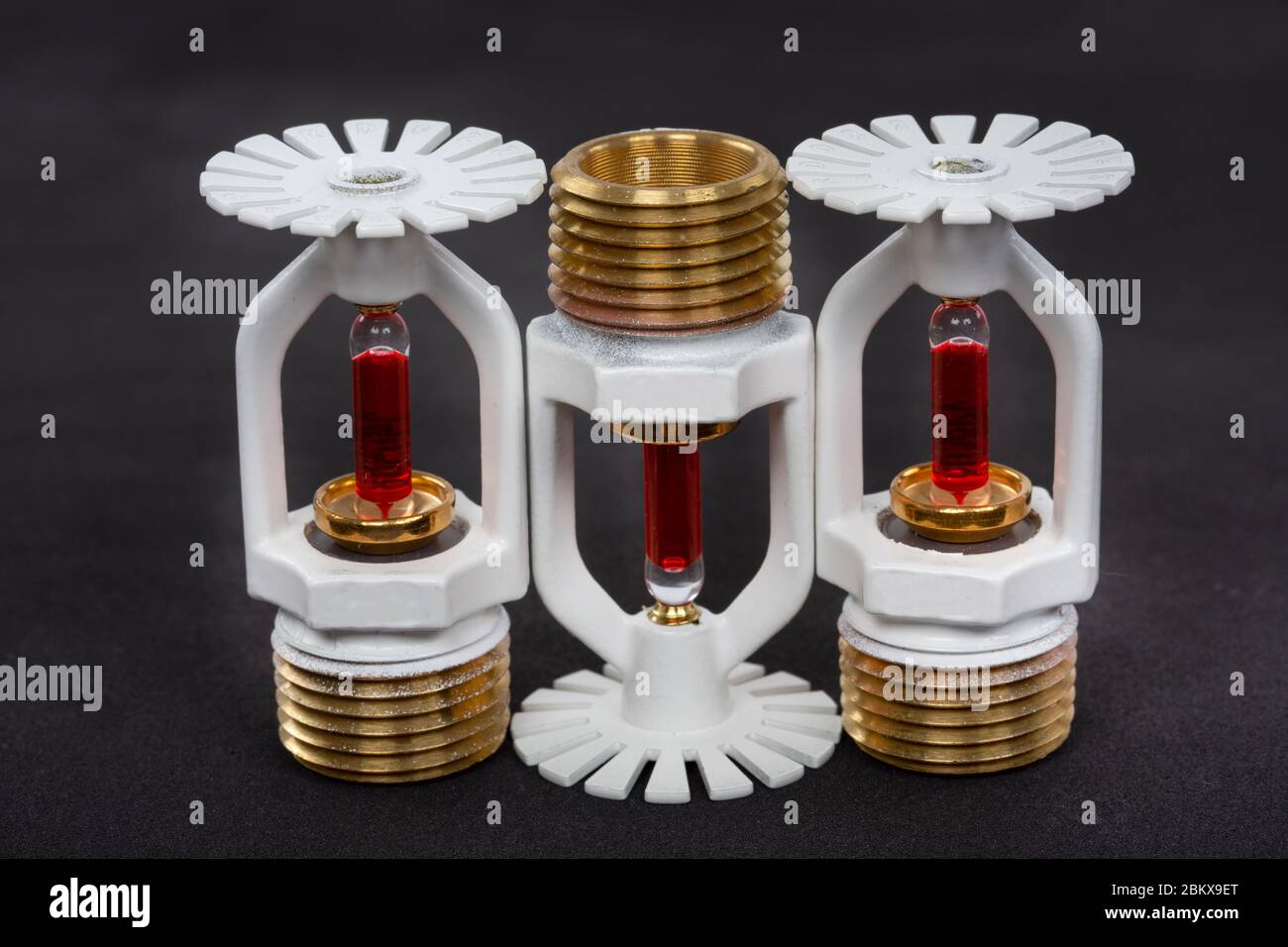 Close up image of fire sprinkler with fire in background. Fire ...