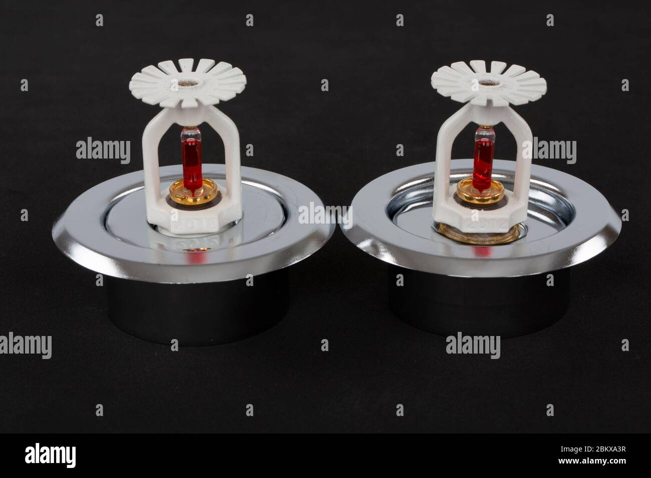 Close up image of fire sprinkler with fire in background. Fire ...