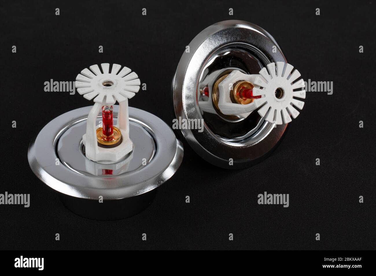 Close up image of fire sprinkler with fire in background. Fire ...