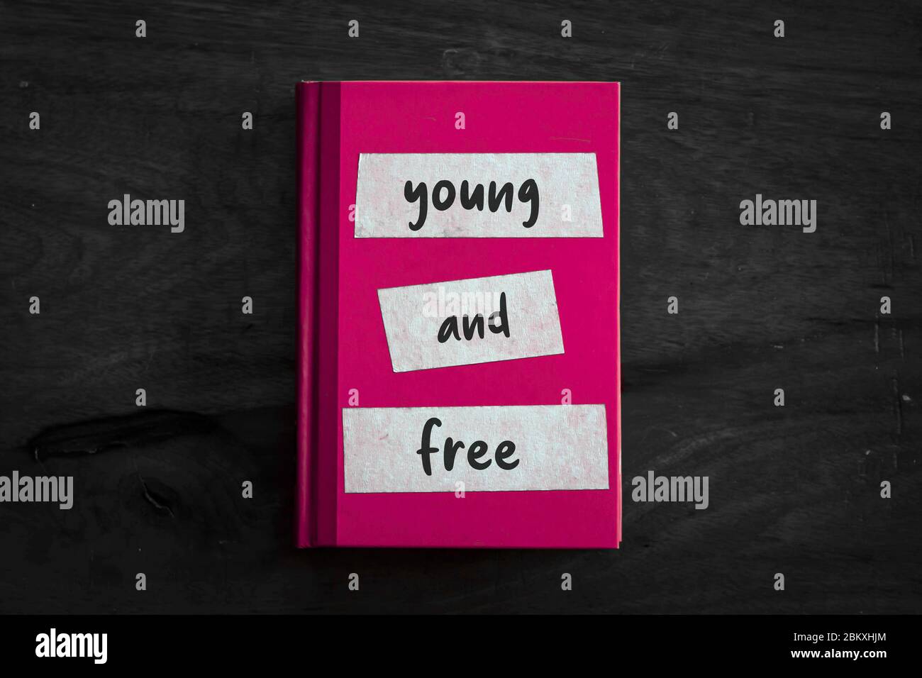 A pink book with three simple words Stock Photo - Alamy