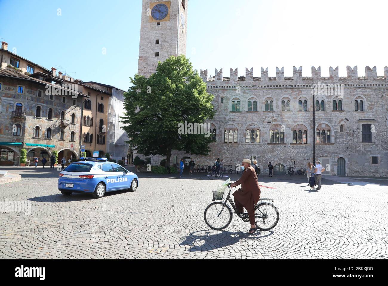 Trento, Italy. 04th May, 2020. A man on a bike at Piazza Duomo amid the ...