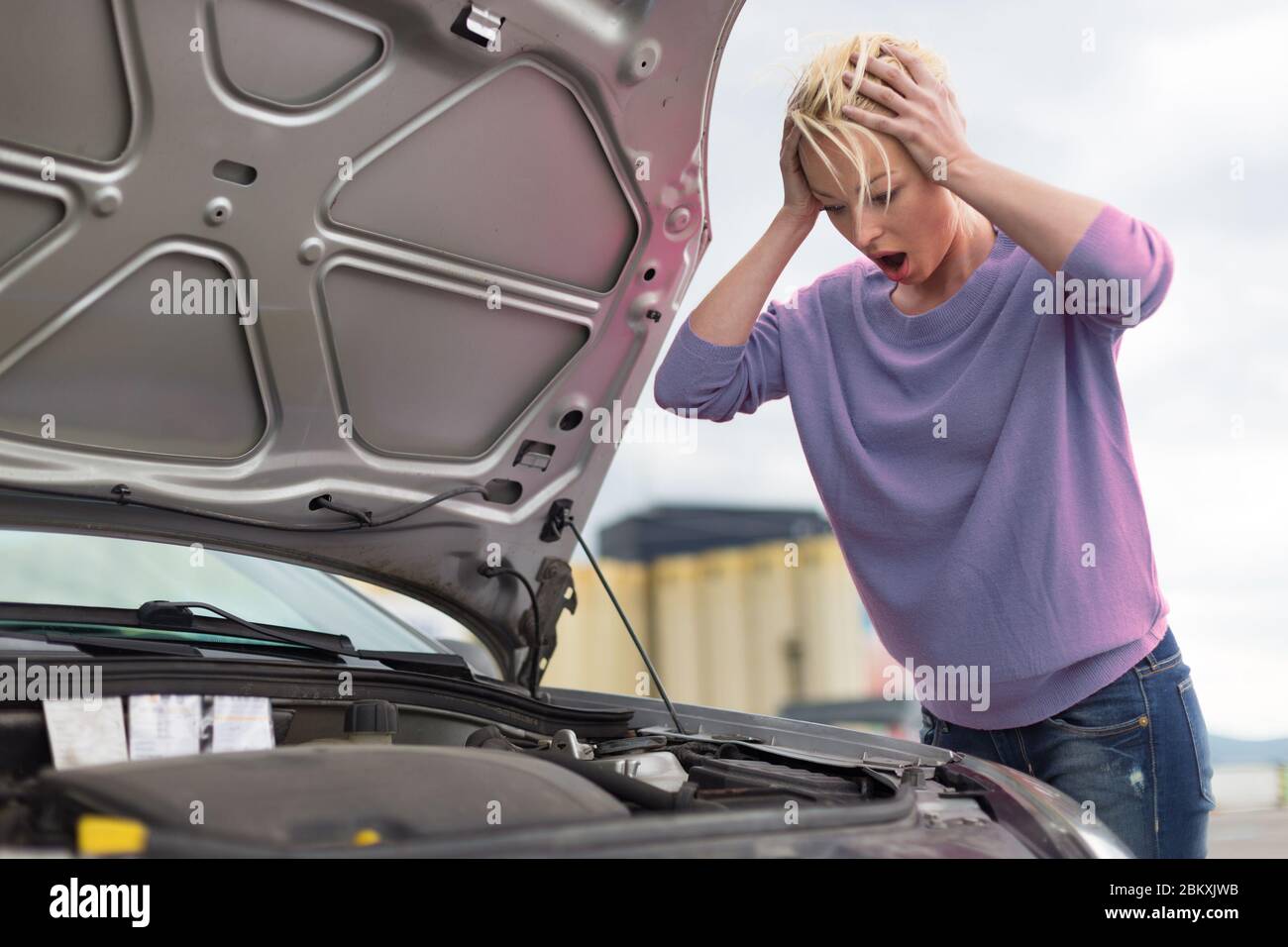 Stressed Young Woman with Engine Breakdown Car Defect Stock Photo - Alamy
