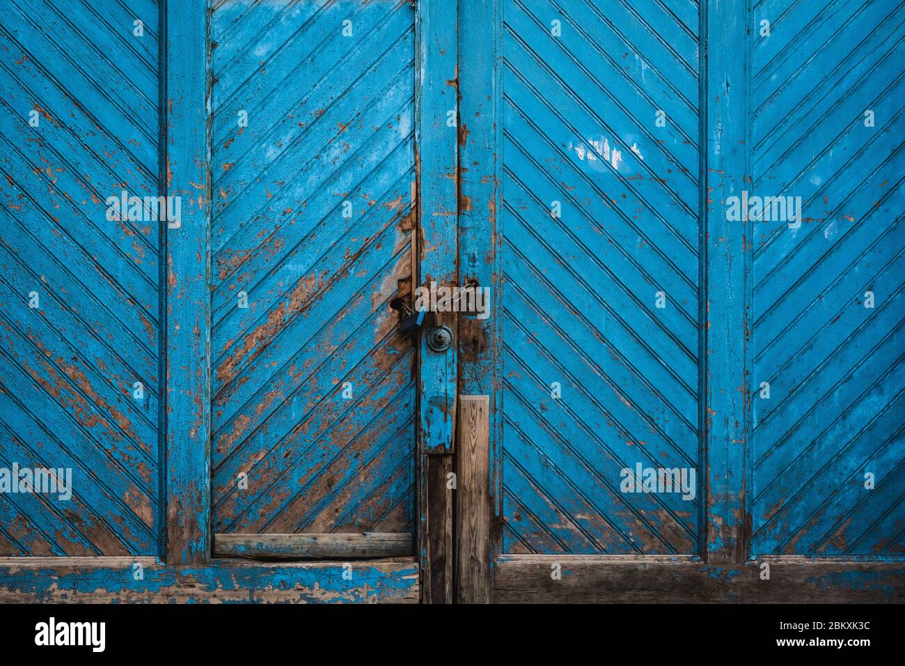 Blue rustic wooden door of an old factory Stock Photo - Alamy