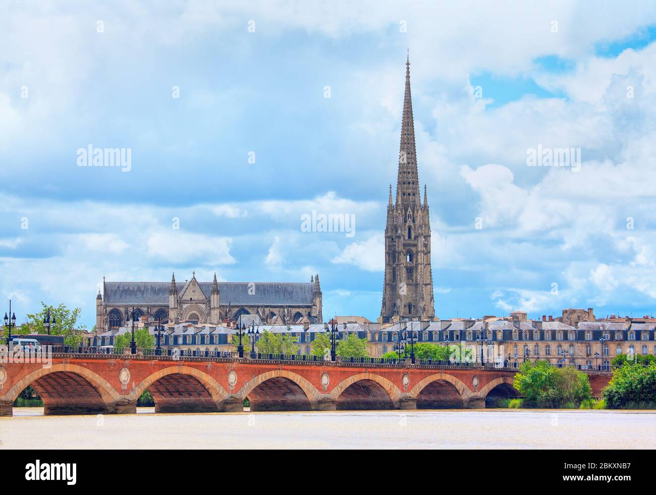 Famous Pont de Pierre and Basilica of Saint Michael in Bordeaux Stock ...