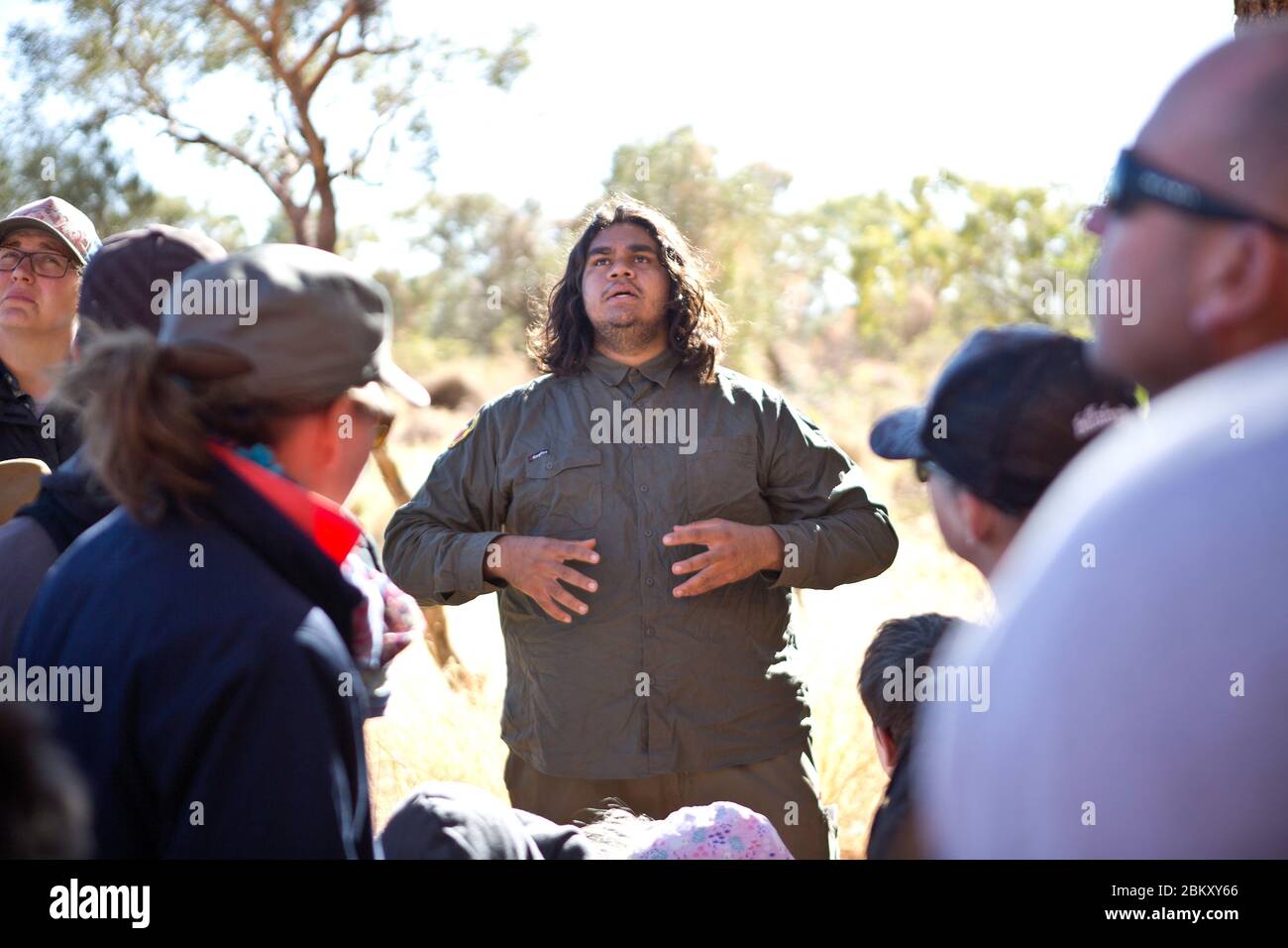 Indigenous guide on Mala Walk around the foot of Uluru, Northern ...