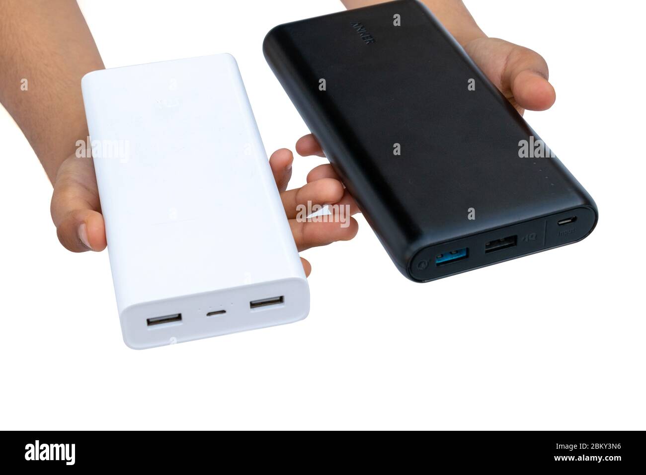 Hands holding battery charger (Power bank) black and white isolated on ...