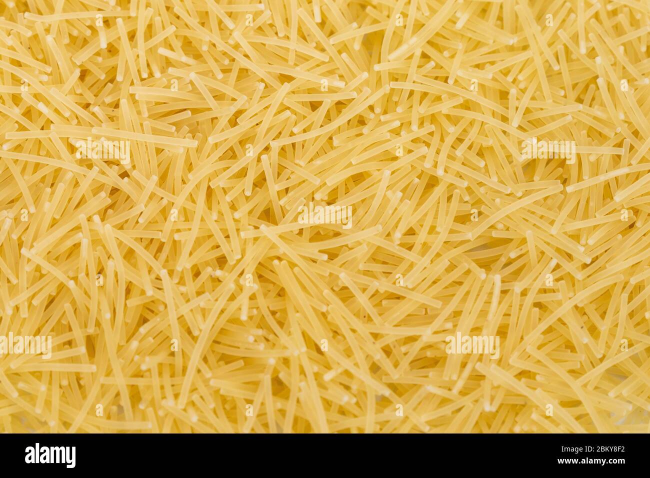 Raw vermicelli pasta (italian pasta) background, close up Stock Photo ...