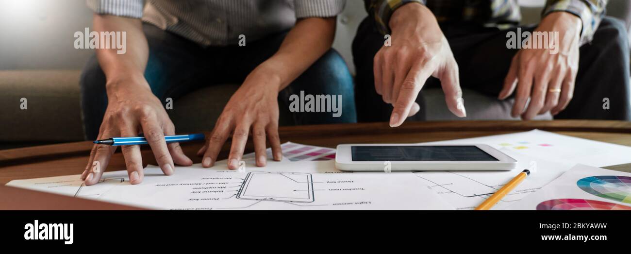 Creative team analyzing prototype products for product design in ...