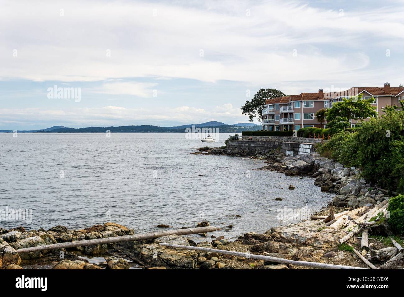 haro strait shore with residential building calm water and cloudy sky ...