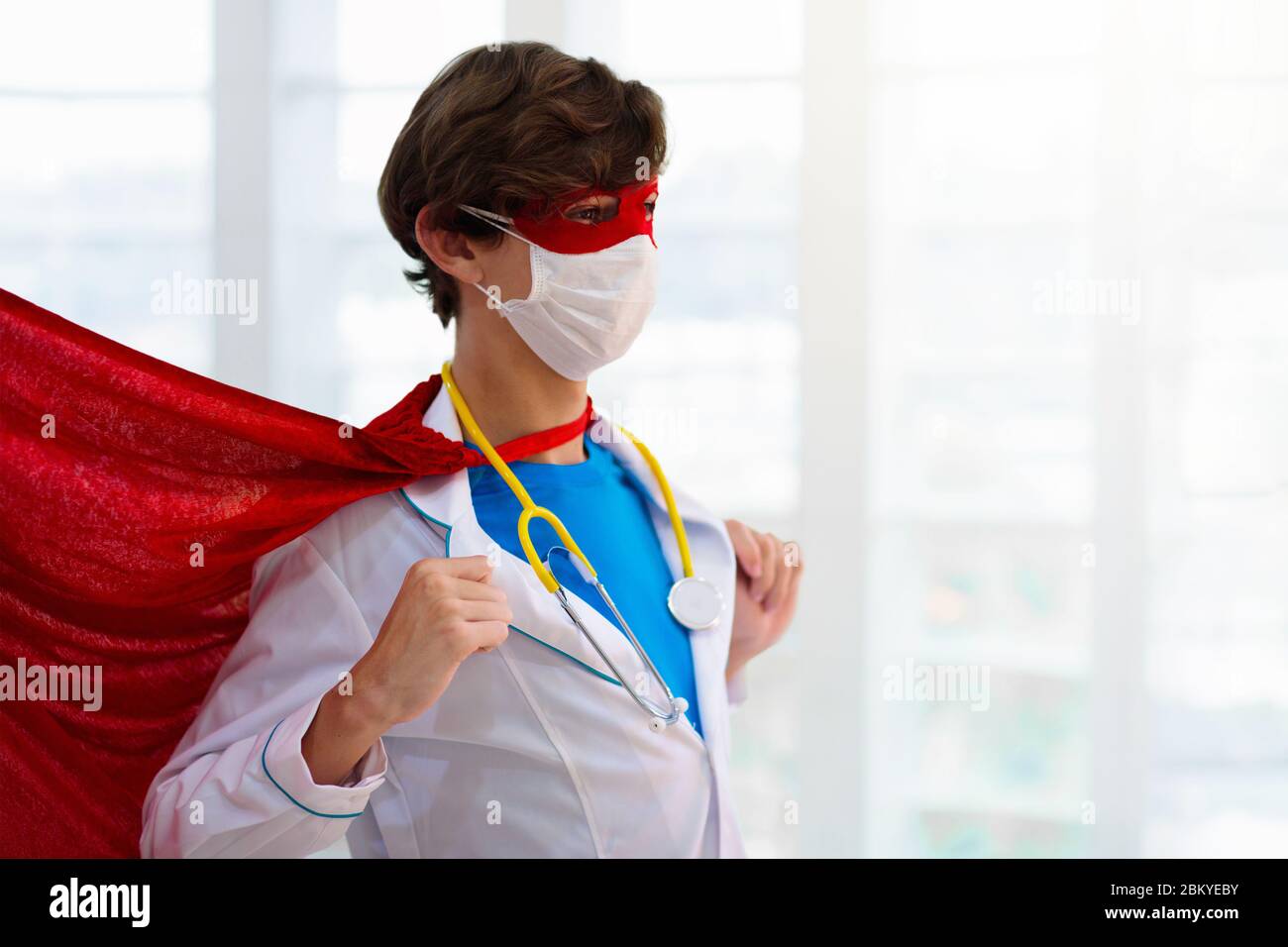 Doctor or nurse wearing surgical face mask in superhero cape. Medical ...