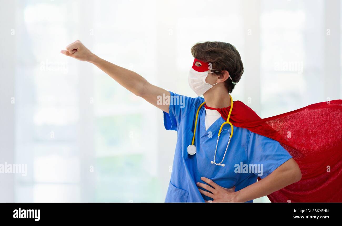 Doctor or nurse wearing surgical face mask in superhero cape. Medical ...