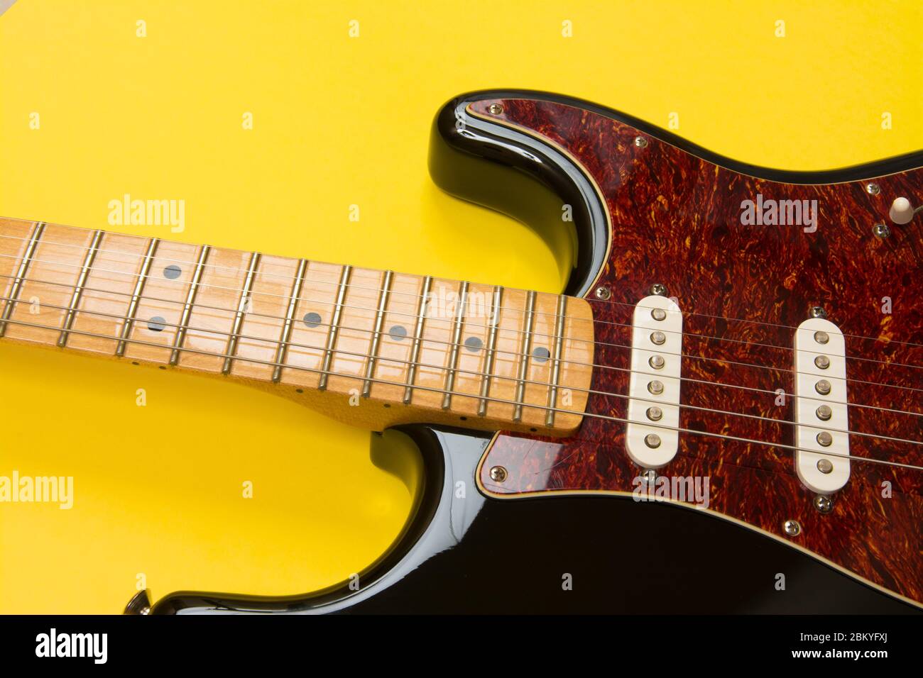 Close-up of electric guitar on yellow background, with copy space Stock ...