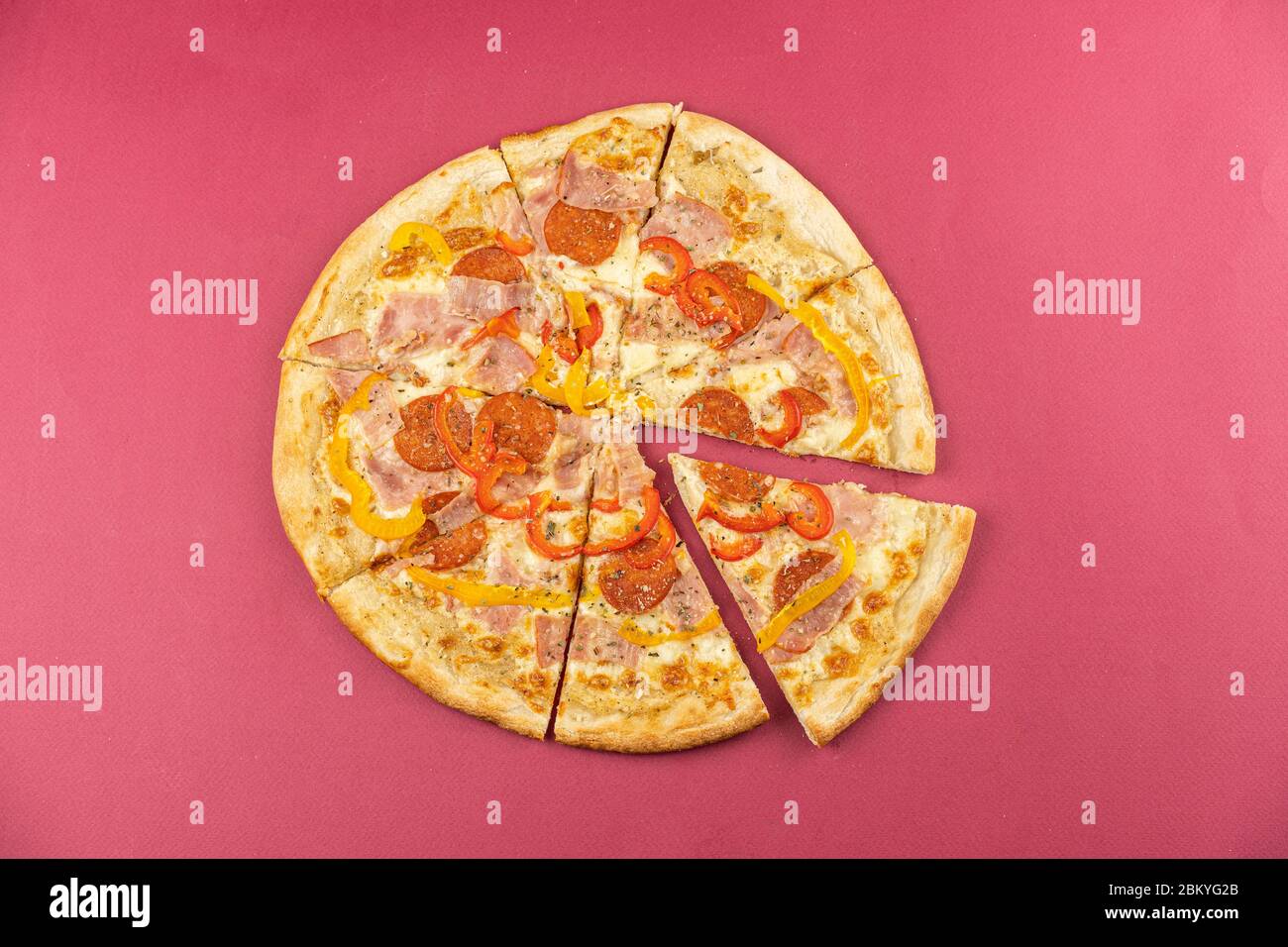 pizza close-up, isolated, against a colored background. whole pizza ...