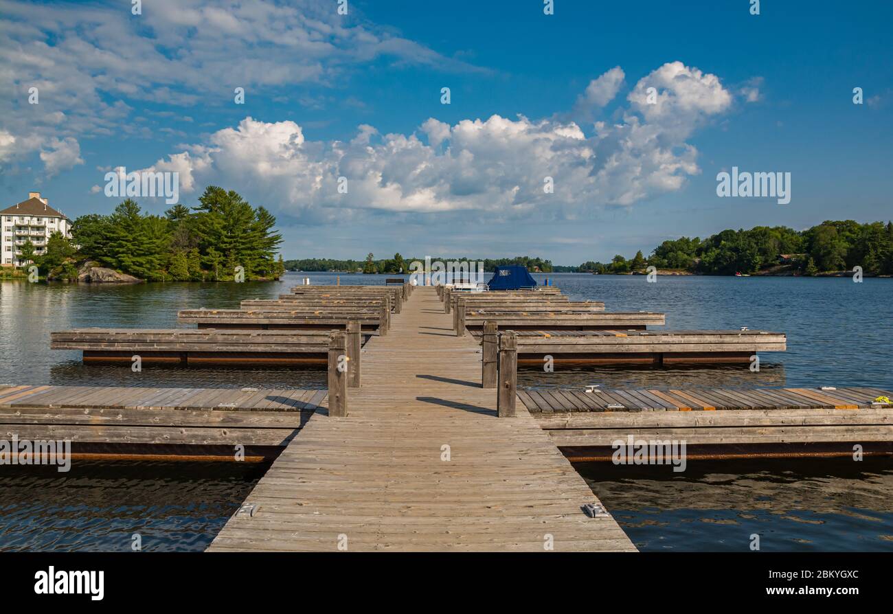 Wooden Docks and blue lake Stock Photo - Alamy