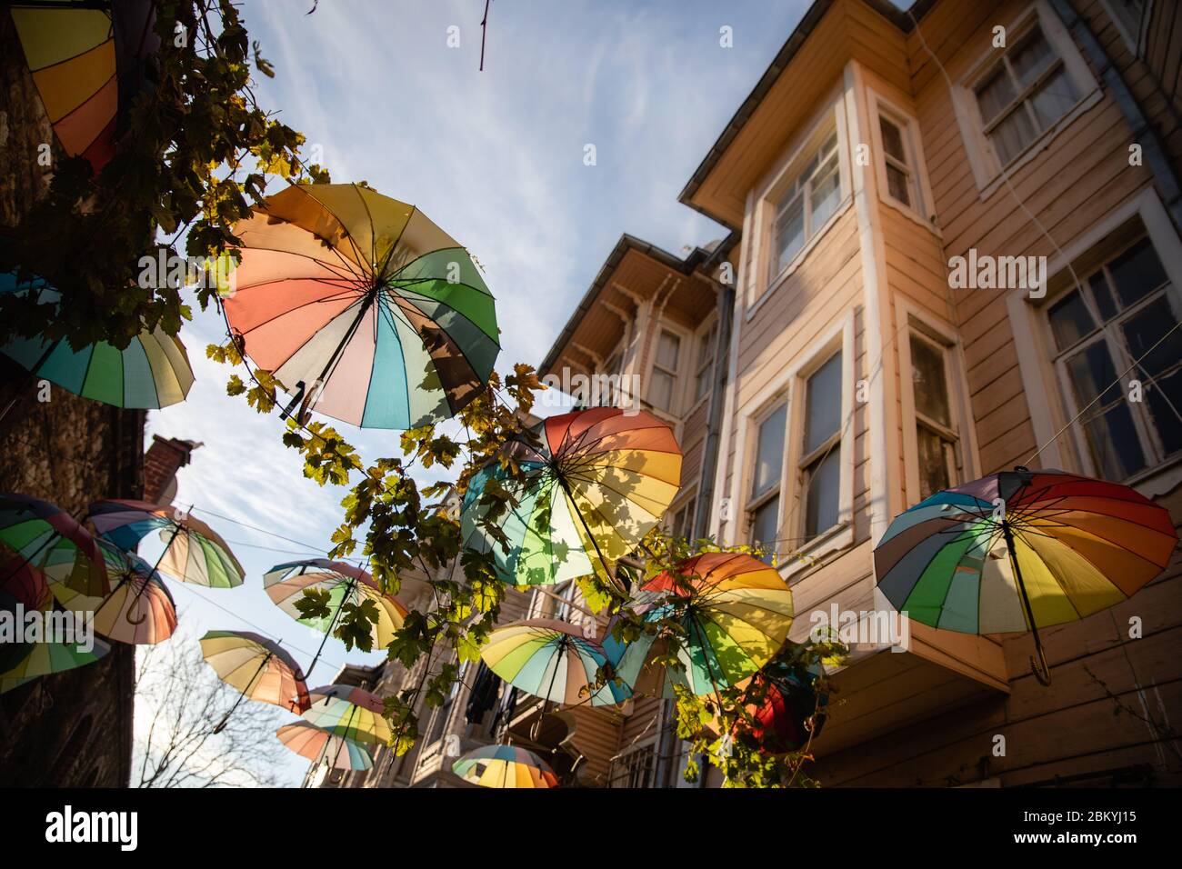 Colorful hanging umbrellas overhead on street view of Istanbul city ...