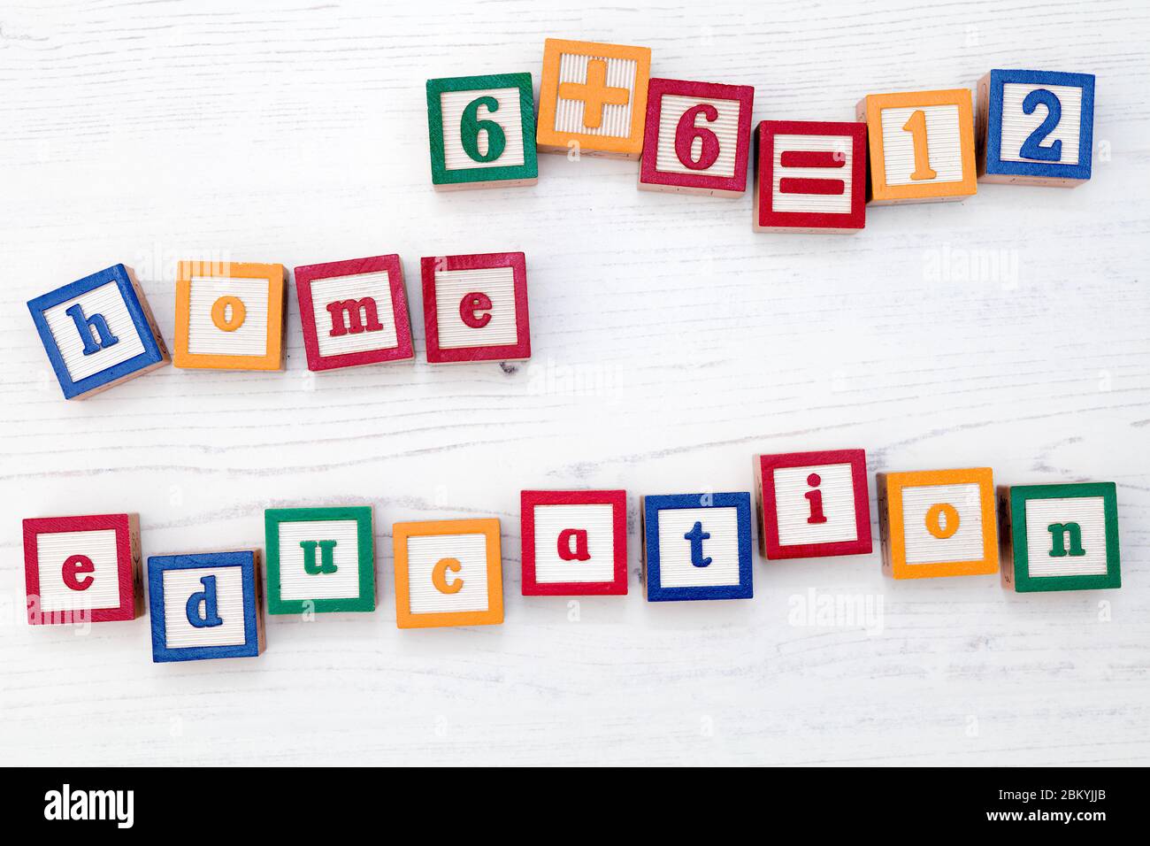 Children’s wooden spelling blocks spell out the words home education ...