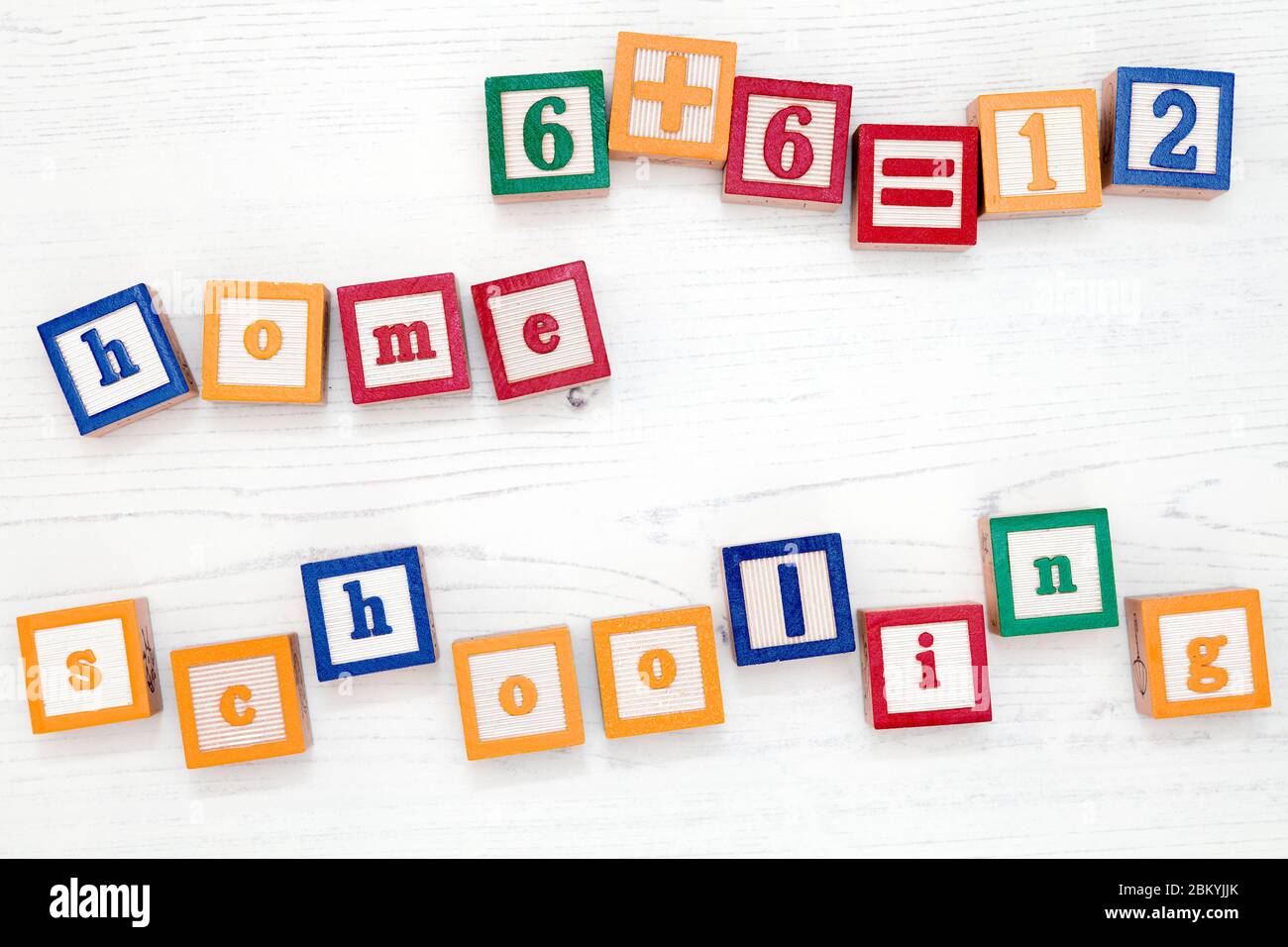 Children’s wooden spelling blocks spell out the words home schooling ...
